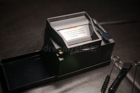 The Process Of Putting Tobacco Into Cigarette Cases With A Semi Automatic Machine Stock Image