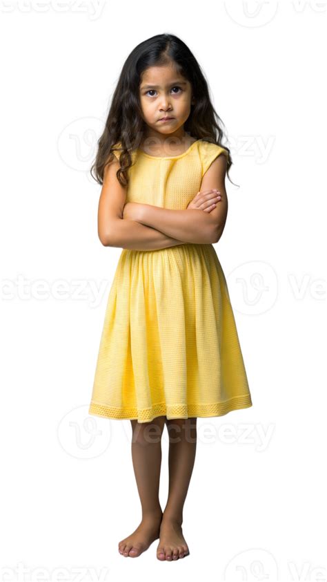 Young Girl Wearing A Yellow Dress With Arms Crossed Displaying A
