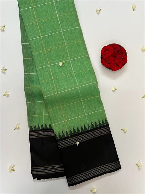 checked black kanjeevaram silk saree with red border