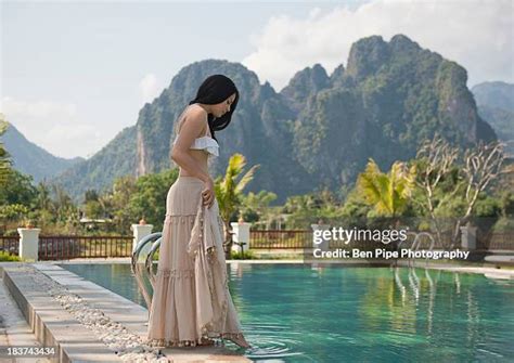 Woman Dipping Toe In Swimming Pool Photos And Premium High Res Pictures