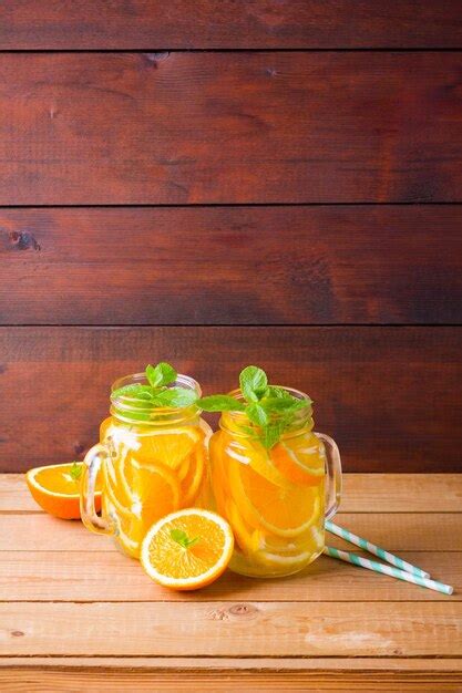 Premium Photo Fruit Infused Water With Orange Fruit Lemon And Mint