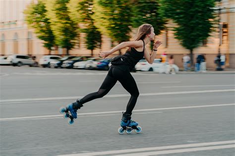 Professional Female Roller Demonstrates Her Abilities Of Rollerblading