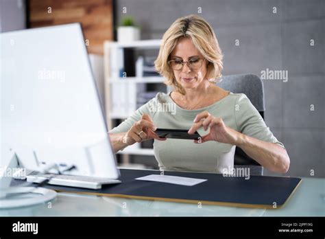 Remote Check Deposit Taking Photo With Mobile Phone Stock Photo Alamy