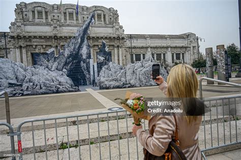 A Woman Take Photos To The Sculptural Anamorphosis Installation La