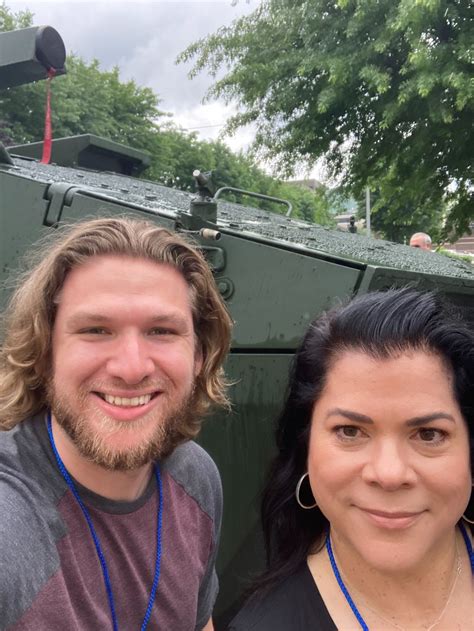 Admiring The Military Equipment On Display At The Showcase For Commerce