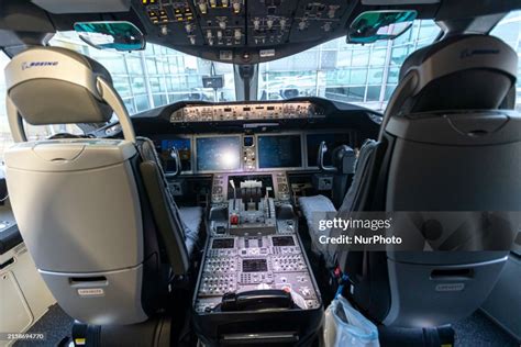 The Flight Deck Known As Cockpit With The Pilot Seats And All The