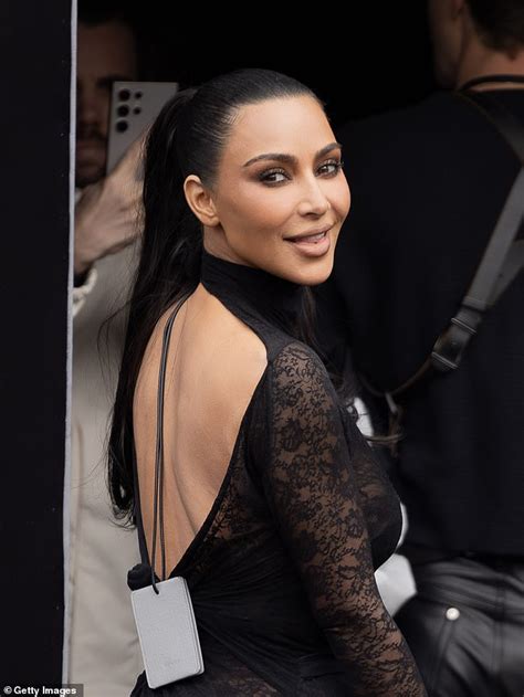 Kim Kardashian Hides Her Sexy Sheer Bodysuit Underneath A Huge