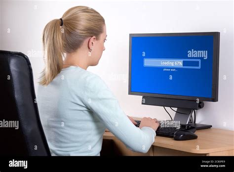Software Concept Back View Of Woman Using Personal Computer In Office Stock Photo Alamy