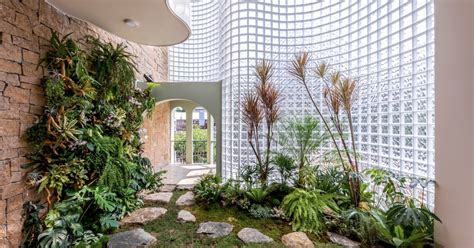 Curved Facade Of 3000 Glass Bricks Wraps Da Vang Studios Translucent