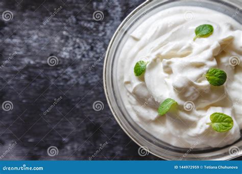 Creamy Curd Cream Yogurt With Mint In A Bowl On A Dark Retro Background Top View Stock Image