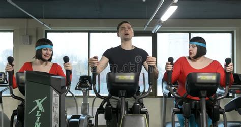 A Trainer With Women Trains On Ellipsoids Stock Image Image Of