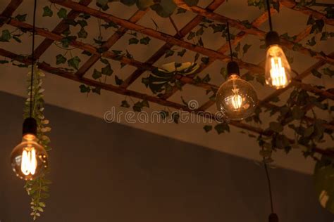 A Modern Lamp Made Of A Wooden Lattice Decorated With Plants Modern