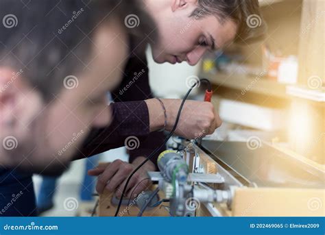 Scientists Engineers Designing Small Human Robot Setting Artificial Intelligence Humanoid Robot