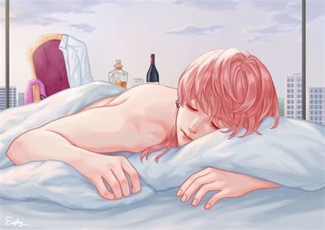 A Naked Woman Laying In Bed Next To A Bottle