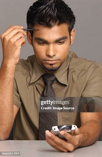 Asian Man Face Looking Down Photos And Premium High Res Pictures