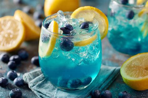 Vibrant Blue Curacao Mocktail With Fresh Blueberries And Lemon Recipe
