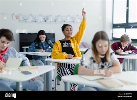 High School Students Paying Attention In Class Sitting In Their Desks