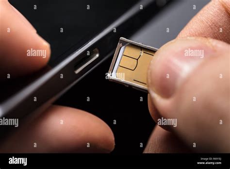 Inserting A Sim Card Hi Res Stock Photography And Images Alamy