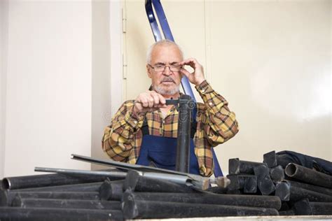 Engineer Measures With Tool The Size Of The Pipe Stock Photo Image Of Male Professional
