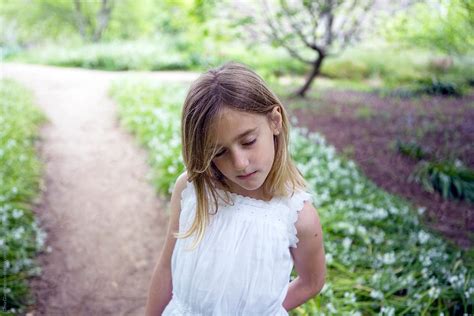 Girl With Closed Eyes Standing On A Path By Stocksy Contributor Dina