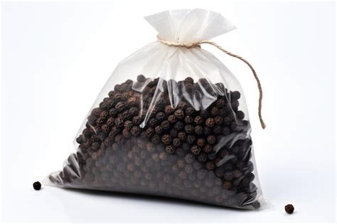 Premium Photo Black Pepper In Plastic Packaging Isolated On White