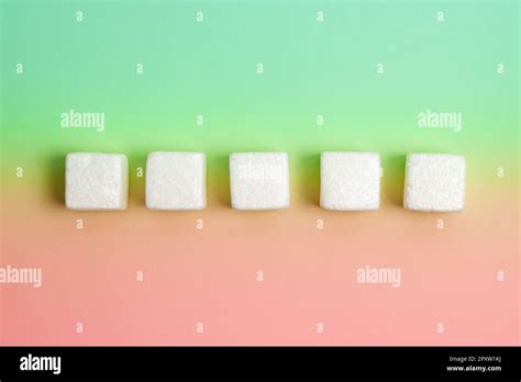 White Styrofoam Cubes Lying On Coloured Desk Brand New Information