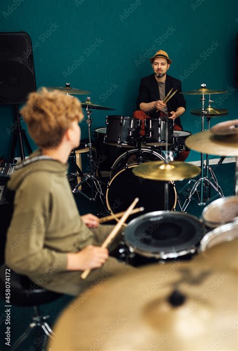The Teacher Shows The Babe How To Play The Drums Correctly Lesson At The Music Babe Stock