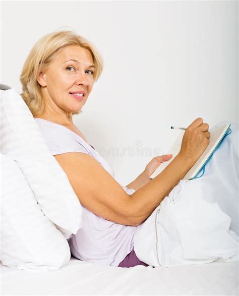 Blonde Mature Woman Writing In Diary Stock Image Image Of Pocket