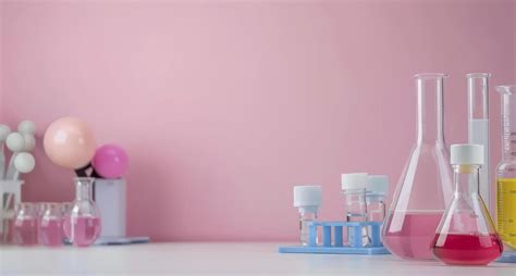 Laboratory Microscopy Setup With Glassware And Pink Background In