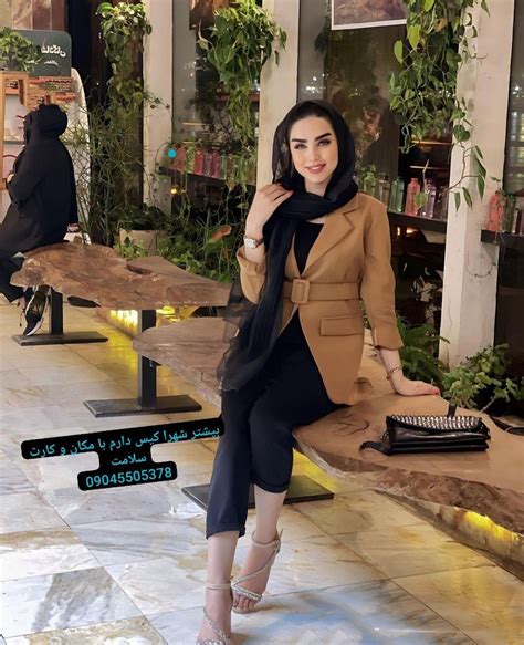 Woman Sitting On Bench With Plants