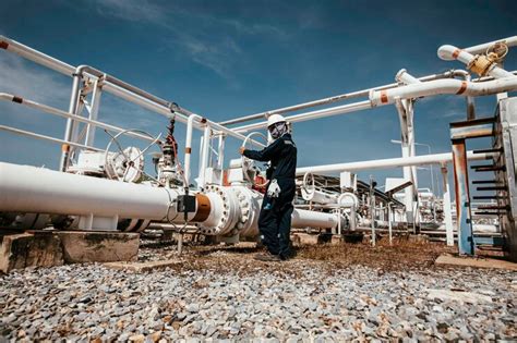 Premium Photo Production Operator Opening Ball Valve At Pipeline Oil