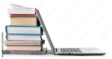 Stack Of Books With Laptop On Table Stock Photo Adobe Stock
