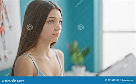 Young Beautiful Girl Doctor And Patient Having Medical Consultation At