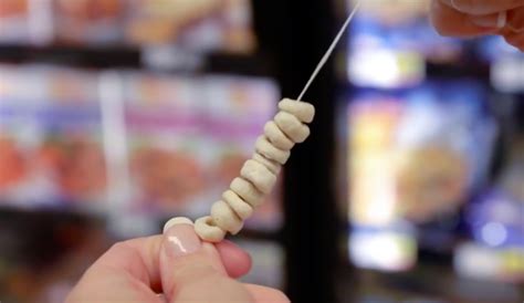 The Reason Why She Is Stringing Cheerios Onto Dental Floss Is Brilliant