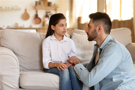 Premium Photo Father And Daughter Having A Serious Conversation