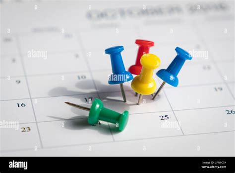 multiple pins on one date on a calendar busy and fully booked schedule