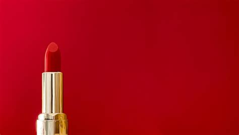 Premium Photo Red Lipstick In Golden Tube On Colour Background Luxury