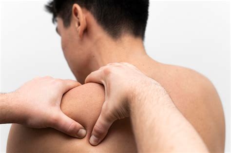 Free Photo Man Getting Shoulder Massage From Physiotherapist