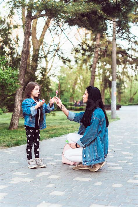 Mom Gives The Girl Candy Stock Image Colourbox