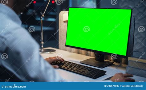 Close Up Of A Businessman Working On Desktop Computer With Chroma Key Green Screen Mock Up