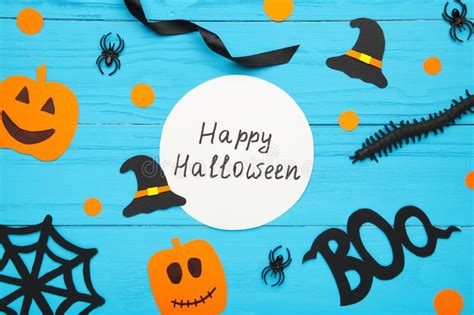 Happy Halloween Background With Decoration On Blue Wooden Background