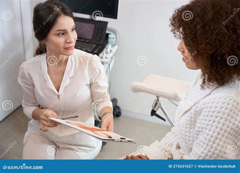 Young Woman And Doctor Lady At A Gynecologist Appointment Stock Image