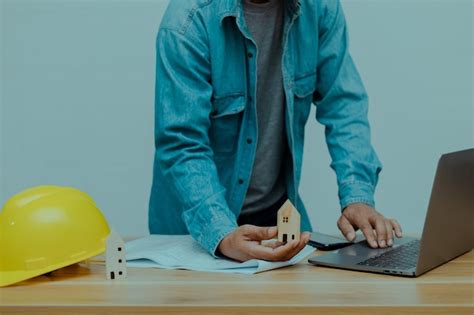 Premium Photo An Engineer Looking At A Residential Construction Plan