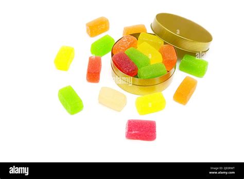 Delicious Mixture Of Various Fruit Jelly Cubes In A Round Tin Candy Box Isolated On White