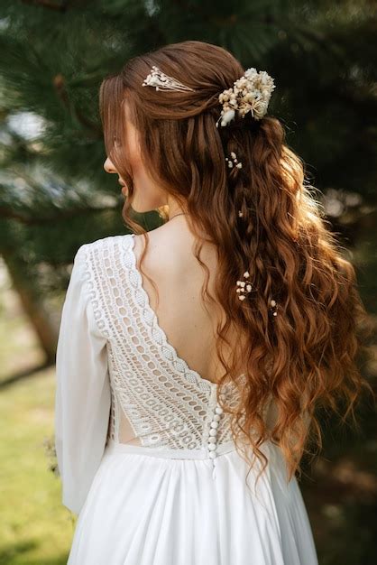 Premium Photo Redhaired Girl Bride With A Wedding Bouquet On A Meadow