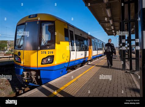 Class 378 Passenger Train In London Overground Livery Waiting At A