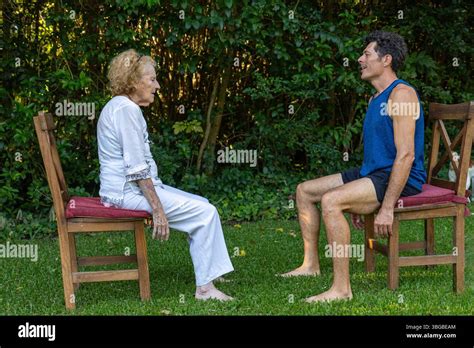 Senior Woman And Her Personal Trainer Practicing Rehabilitation