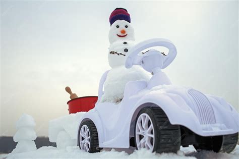 Premium Photo Snowman Driving Toy Car On White Sky