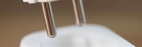 Premium Photo Plugging Or Unplugging Electric Plug Into Socket Connecting And Disconnecting