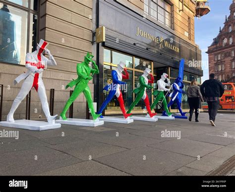 Johnnie Walker Whisky Striding Man Statues In Six Nations Rugby Colours Outside The Johnnie